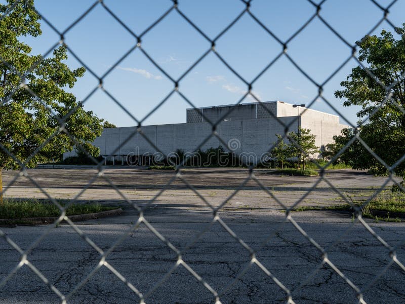 Closed Down Mall through Chainlink Fence Stock Photo - Image of blue ...