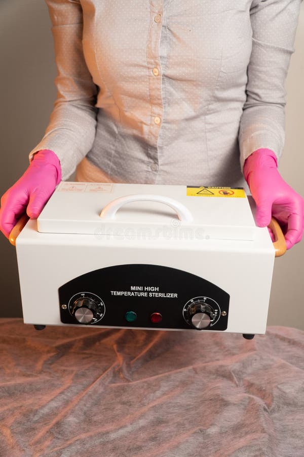 Closed Dry Sterilization of Instruments in Hands Holds Stock Photo ...