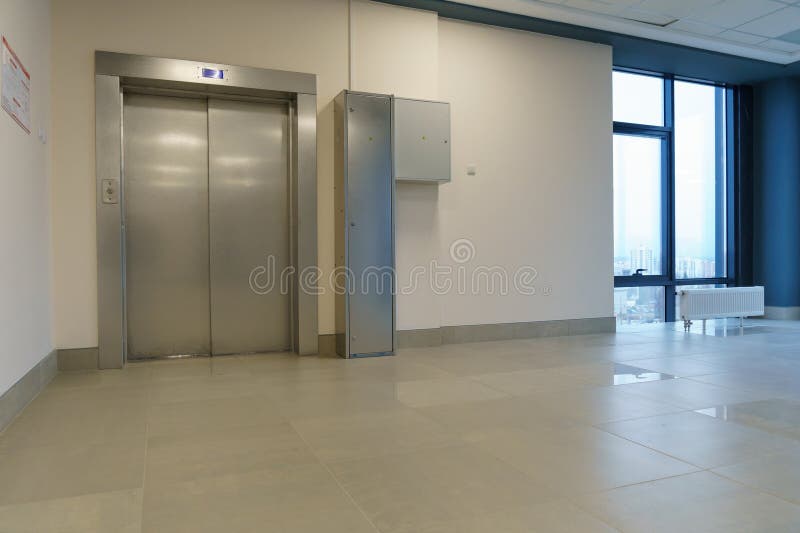 Closed Elevator Doors. Shiny Metal Elevator Doors in a New Modern ...