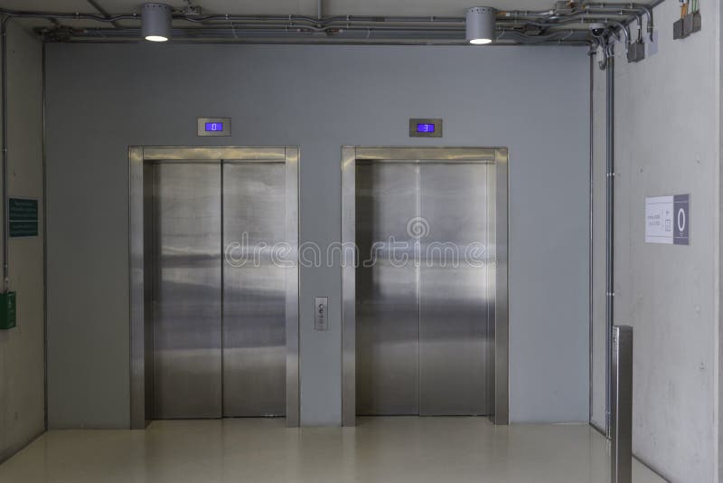 Closed Elevators with Buttons in Corridor with Concrete Walls. Stock ...