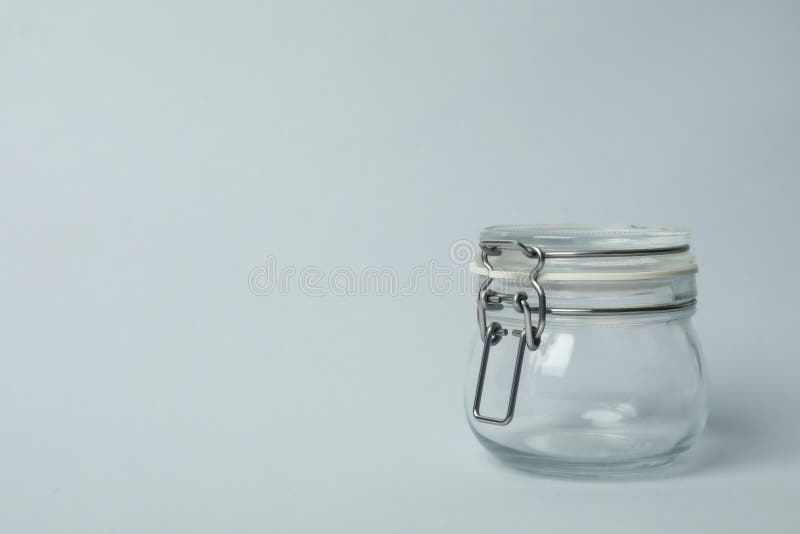 Closed Empty Glass Jar on Light, Space for Text Stock Photo - Image of ...