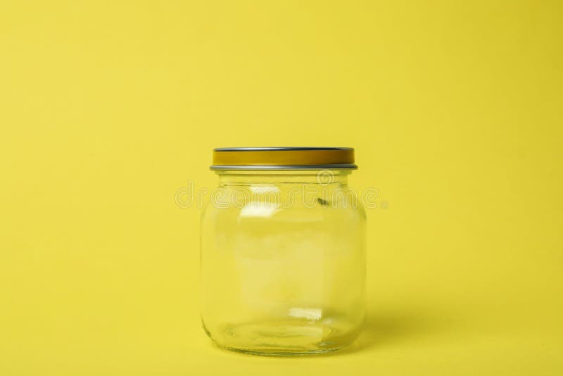 Closed Empty Glass Jar on Yellow Background Stock Photo - Image of ...