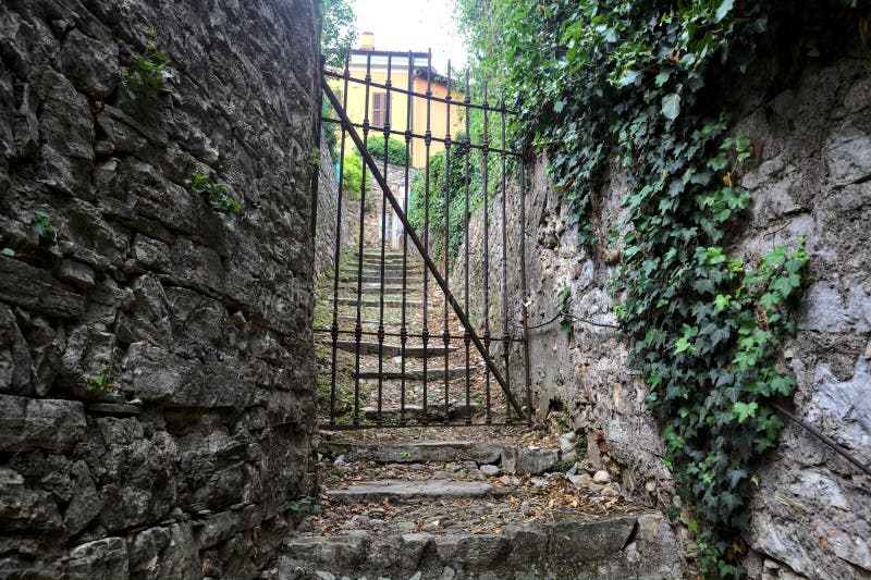 Closed Gate at the End of a Stone Staircase Stock Photo - Image of glow ...