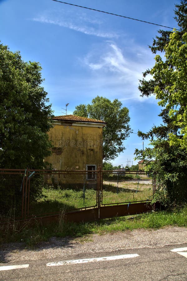 Closed Gate in Front of an Abandoned Building Stock Photo - Image of ...