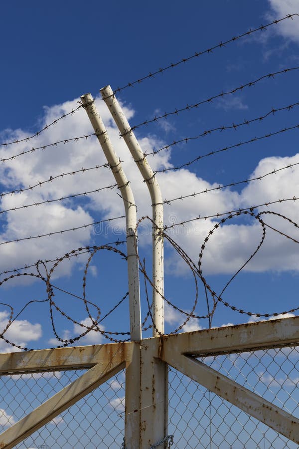 Closed Gates and Posts with Barbed Wire and Mesh Stock Photo - Image of ...