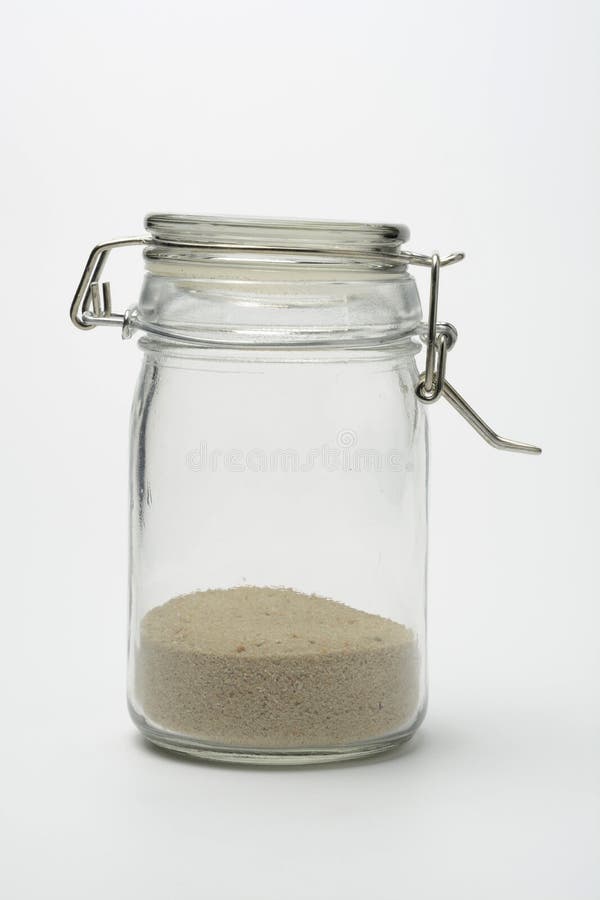 Closed glass jar with sand stock image. Image of metal - 78140713