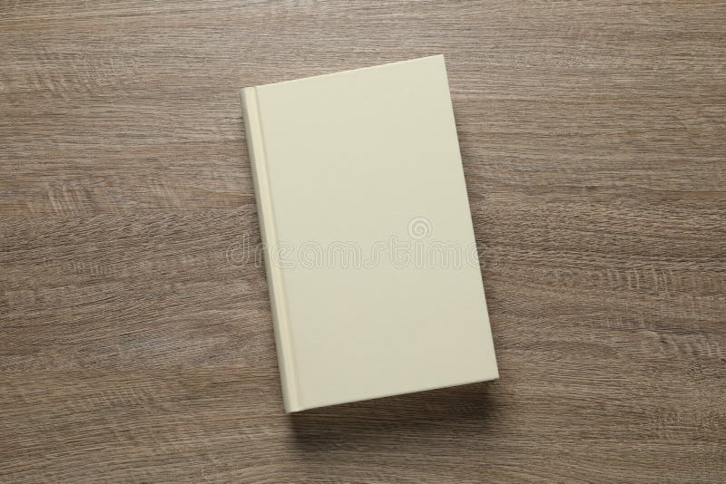 Closed Hardcover Book on Wooden Table, Top View Stock Photo - Image of ...