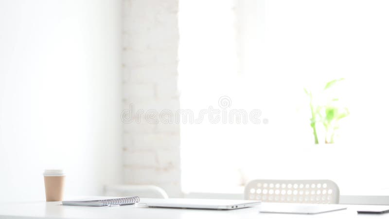 Closed Laptop on Desk in White Loft Office Stock Photo - Image of work ...