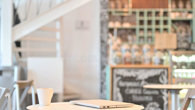Closed Laptop on Table in Coffee Shop Stock Image - Image of typing ...