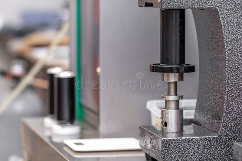 Closed with the Lid of Beverage Cans in an Automatic Capping Machine in ...