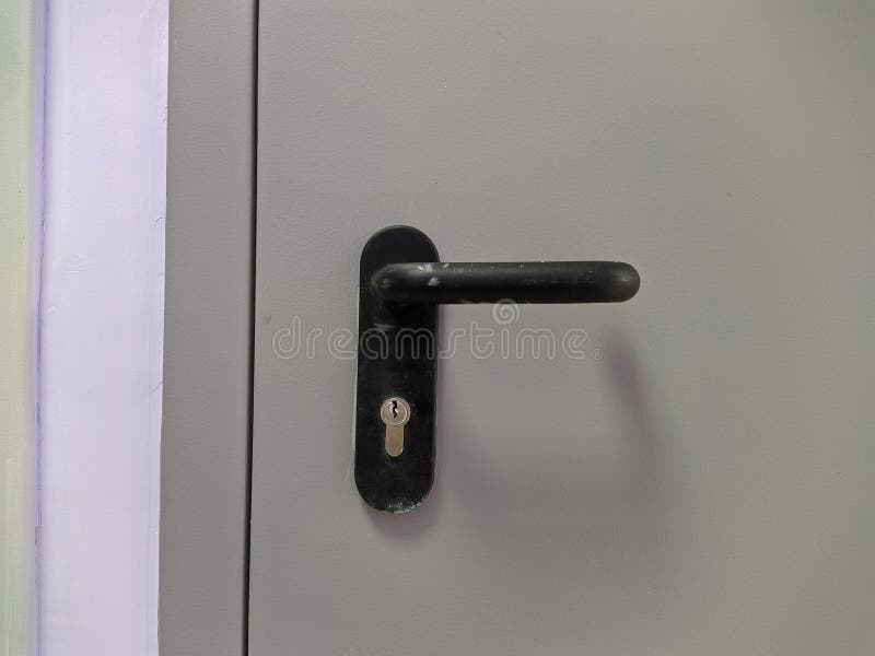 Closed Metal Door with Black Handle Stock Photo - Image of metal, glass ...