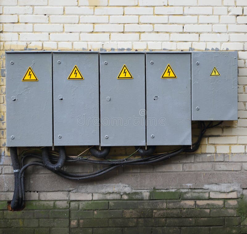 Closed Metal Electrical Panels with High-voltage Markings are Hanging ...
