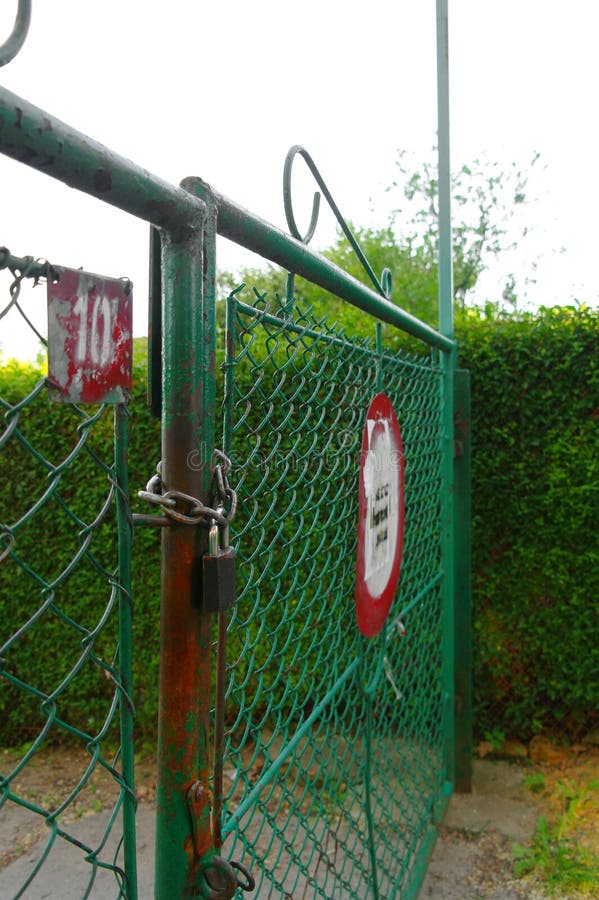 Closed metal gate stock image. Image of mesh, sign, padlock - 52766047