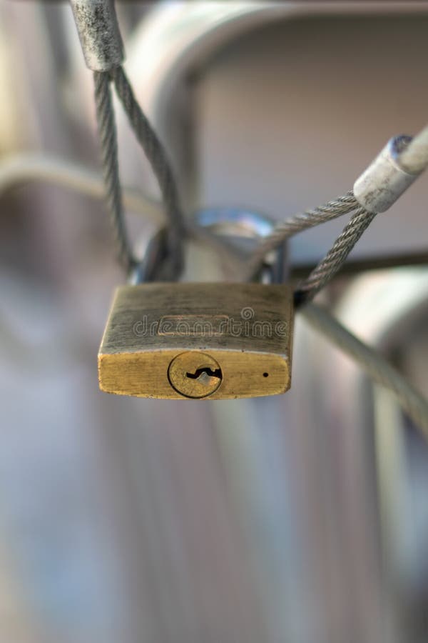 Closed Padlock Attached To Three Steel Wire Ropes Stock Image - Image ...