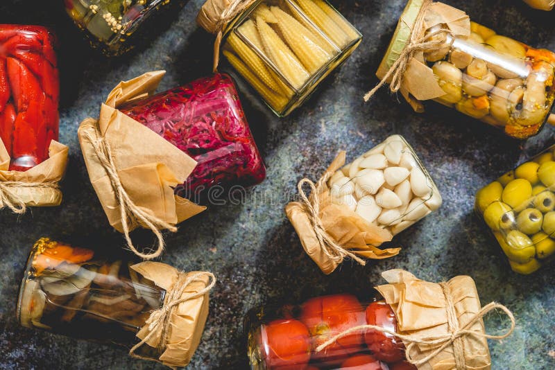 Closed Pickling Jars with Various Vegetables on Stone Table Stock Image ...