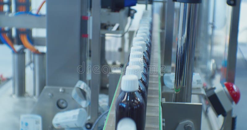Closed Plastic Bottles Move Along the Conveyor.close-up Stock Video ...