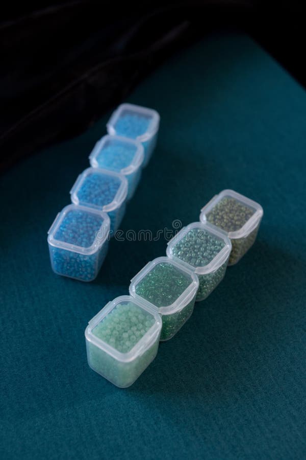 Closed Plastic Containers Filled with Colored Beads Stock Image - Image ...