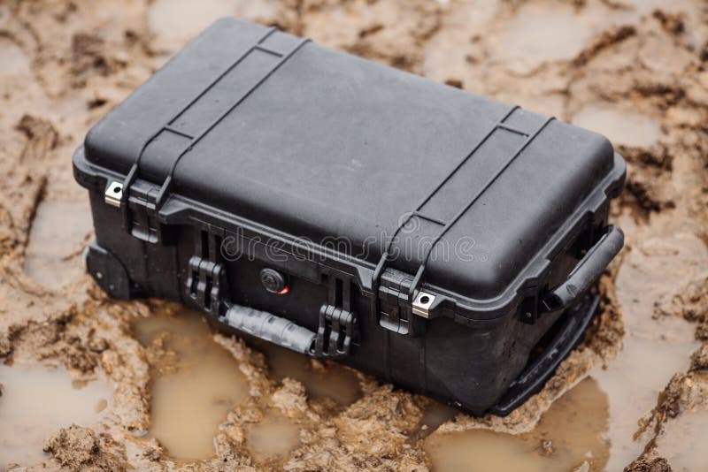 Closed Plastic Protector Case Lying on the Water and Dirt Stock Photo ...