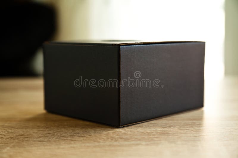 Closed Rectangular Cardboard Box with Corrugated Cardboard Lid, on Oak ...