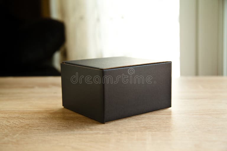 Closed Rectangular Cardboard Box with Corrugated Cardboard Lid, on Oak ...
