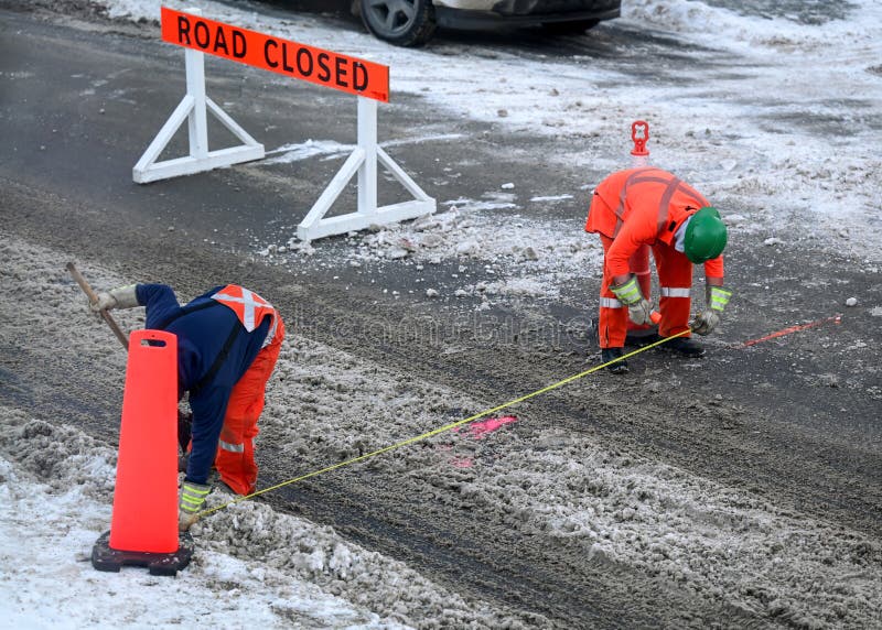 Closed Road with Construction Workers Measuring Stock Image - Image of ...