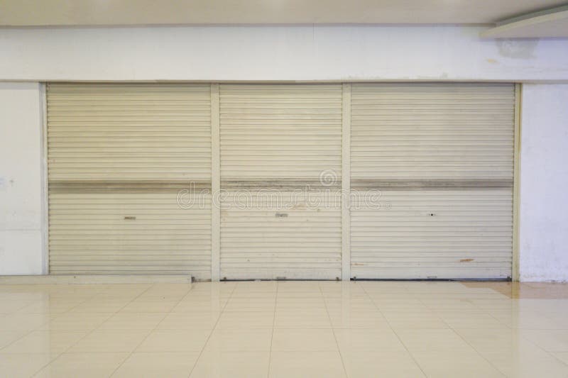 Closed Rolling Door Empty Storefront Commercial Building Stock Photos ...