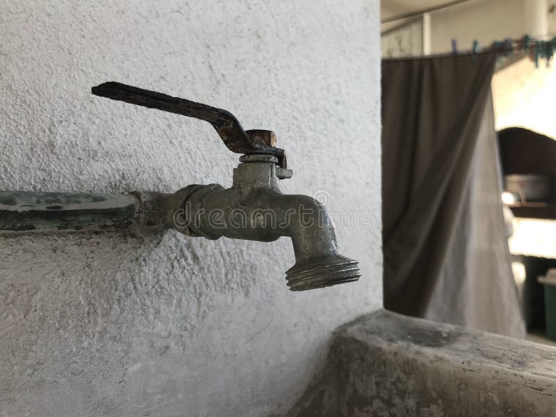 Closed and Rusted Water Tap on a White Wall Stock Photo - Image of wall ...