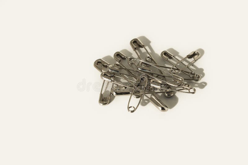 Closed Safety Pins on a White Background Stock Photo - Image of tool ...
