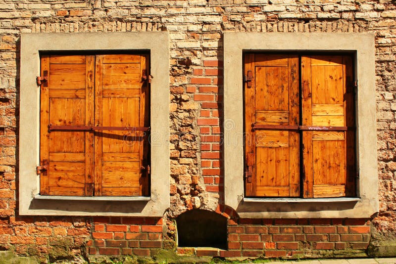 Closed Shuttered Windows with Blinds in Red Brick Wall Stock Photo ...