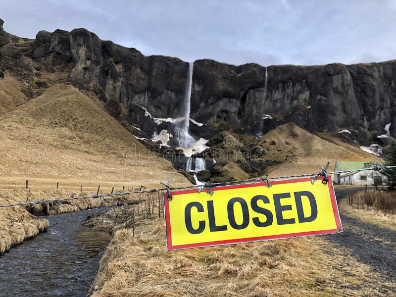 A Closed Sign Against a Waterfall in Iceland Stock Image - Image of ...