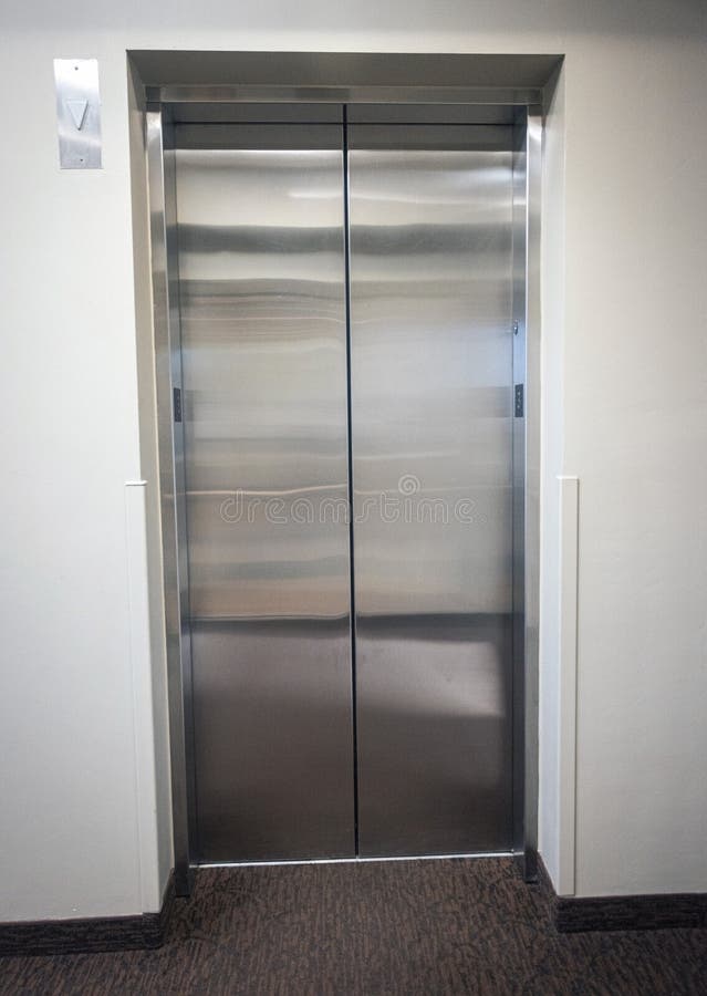 Closed Silver Elevator Doors in a Modern Interior Setting Stock Photo - Image of concept ...