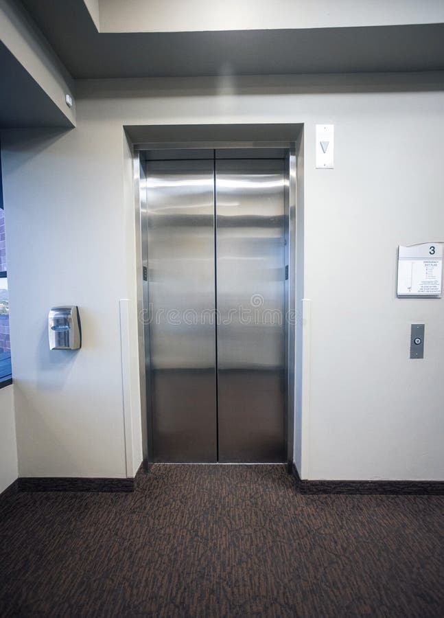 Closed Silver Elevator Doors in a Modern Interior Setting Stock Photo ...