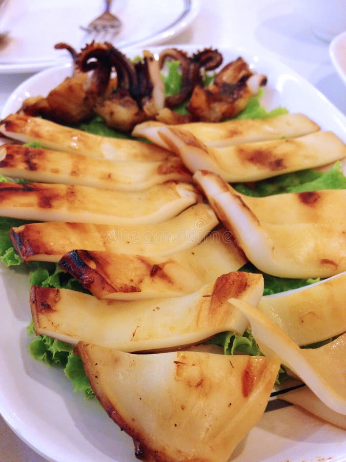 Closed Up Squid Tentacle Sushi from Sushi Set on the Stone Plate. Stock ...