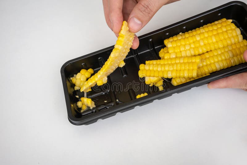 Closed Up Slimy String of Spoiled Corn in Black Plastic Container Kept ...