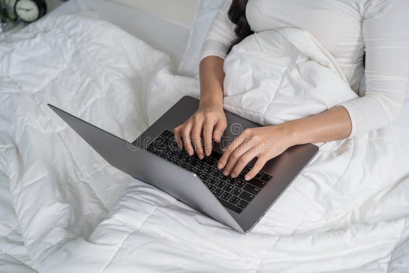 Closed-up Woman Using Laptop Computer on Bed Stock Photo - Image of ...