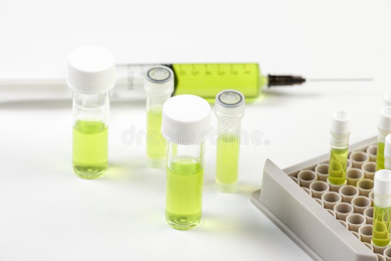 Closed Vials and Syringe Containing Green Liquid Stock Image - Image of ...