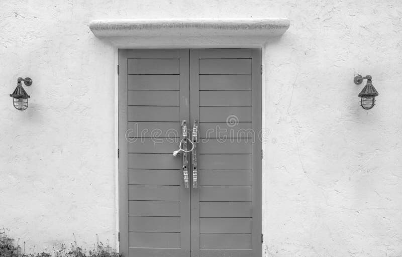 Closed Wood Door and White Concrete Wall of the Building. Lamp on ... Closed Wood Door and White Concrete Wall of the Building. Lamp on ...