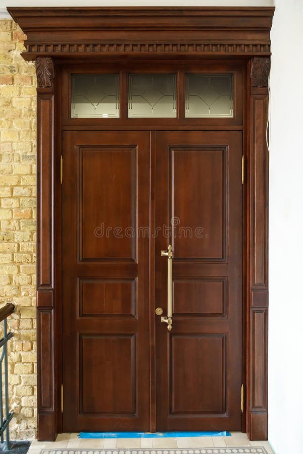 A Closed Wooden Door Inside. Interior Design, Dark Red Door with Metal ...