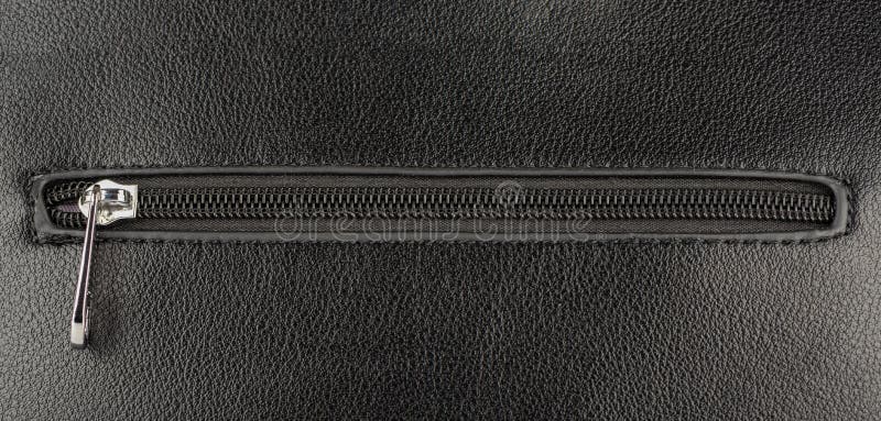 Closed Zip Fastening on Black Leather Surface. Stock Photo - Image of ...