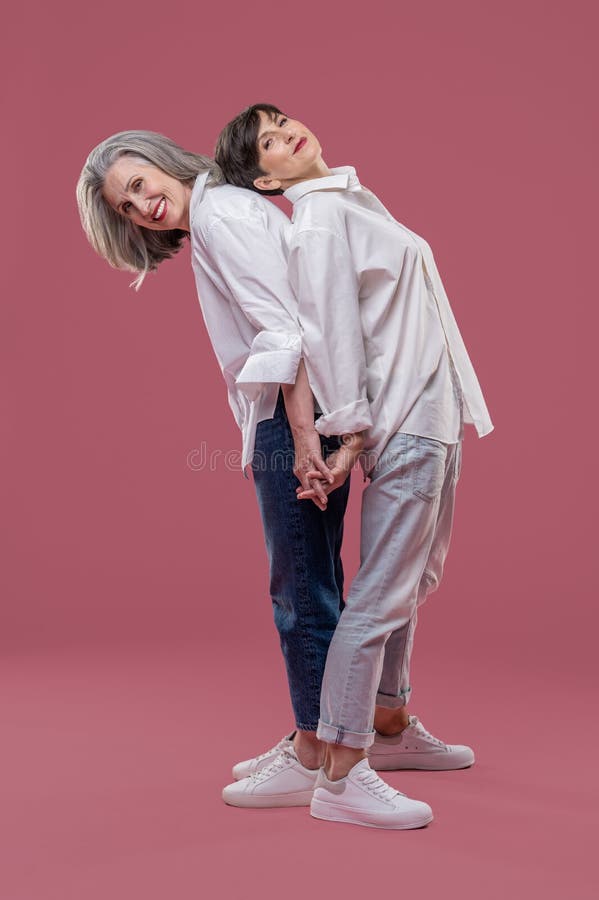 Two Women Standing Back To Back and Feeling Close Stock Image - Image ...