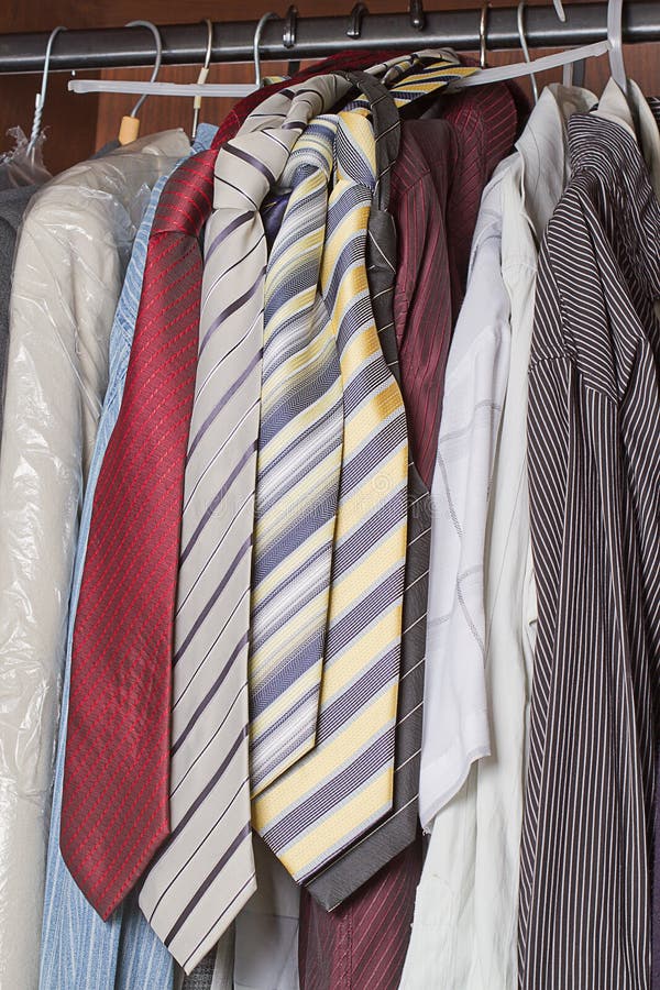 Closet of clothes for men stock image. Image of closeup - 24561519