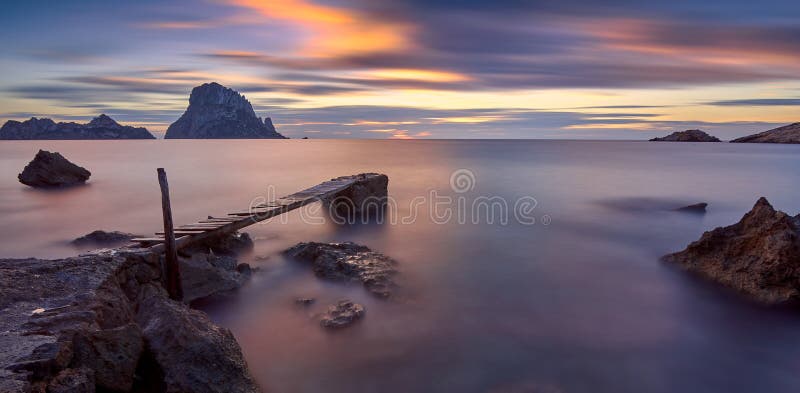 Closeu Shot of a Stream Surrounded by Rocks Under a Sunset Sky Stock ...