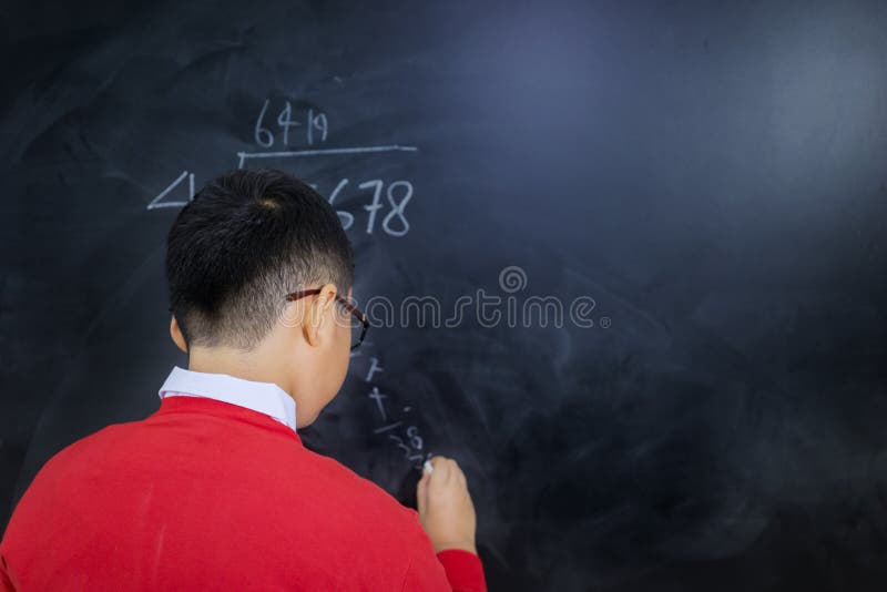 Closeup of an Adorable Boy Solving Calculations Stock Photo - Image of ...
