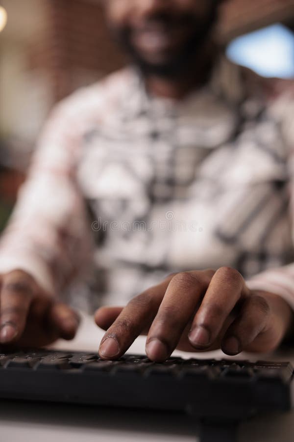 Closeup Of African American Coder Writing Software Using Computer Keyboard While Working Remote