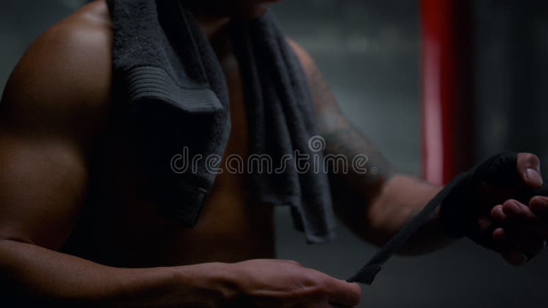 Man Pulling Bandages on Hands. Guy Wrapping Hands with Punching Wraps ...