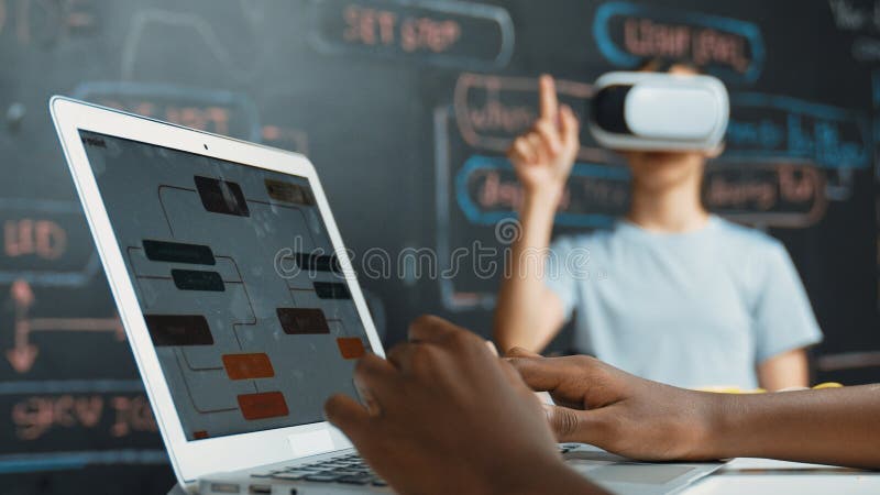 Closeup of African Student Hands Programing System at Blackboard ...