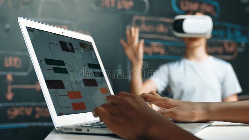 Closeup of African Student Hands Programing System at Blackboard ...