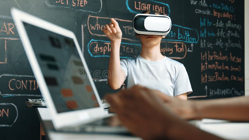Closeup of African Student Hands Programing System at Blackboard ...