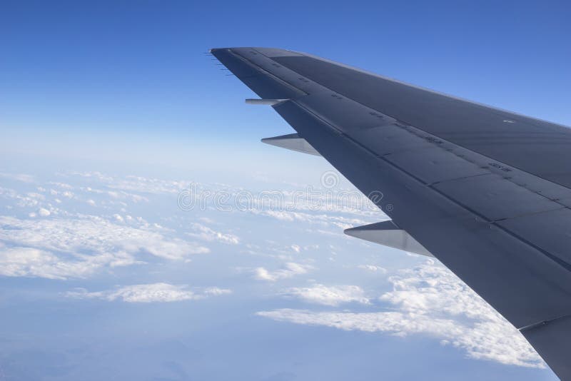 Closeup of an Airplane Wing Flying on a Beautiful Cloud Field Stock ...