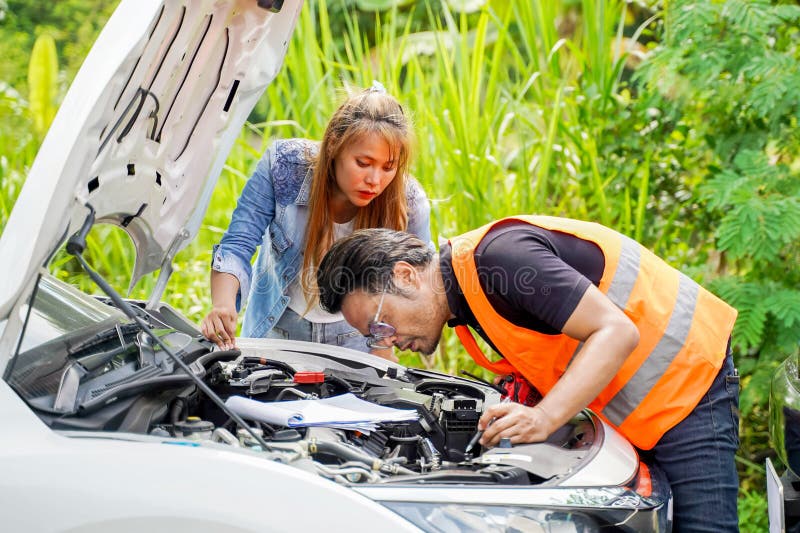 Closeup Auto Mechanic Checking for Breakdowns and List Repairs ...